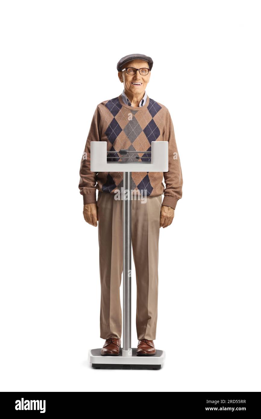 Elderly man standing on a medical weight scale and smiling isolated on ...