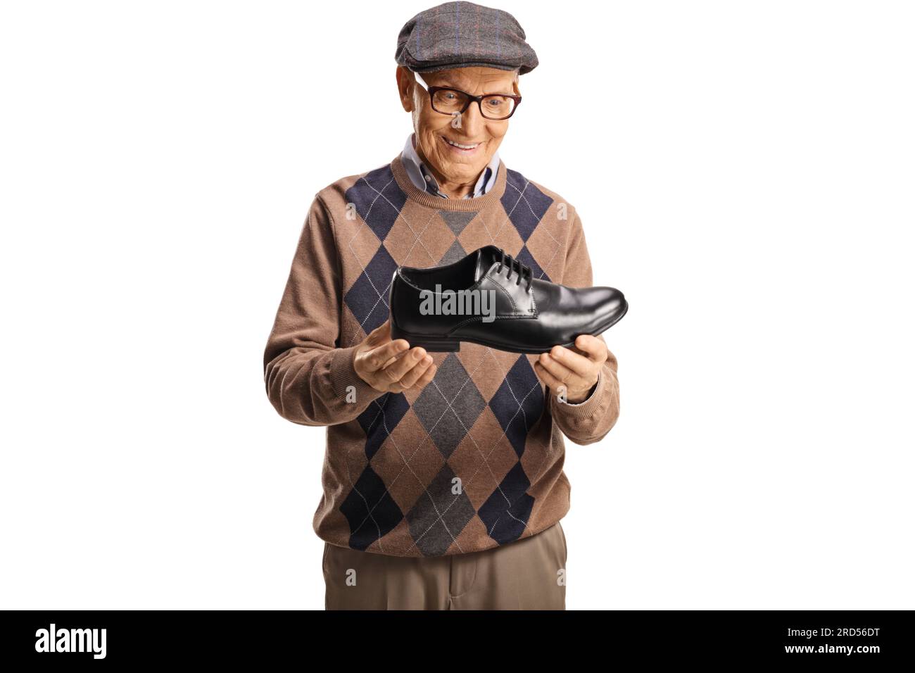 Elderly man holding a black leather shoe isolated on white background ...