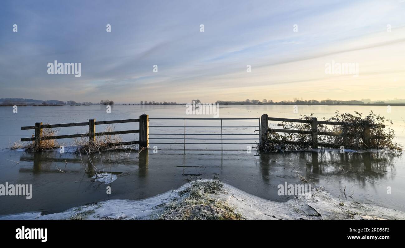 Gate to a submerged field which has frozen over Somerset Levels Near ...