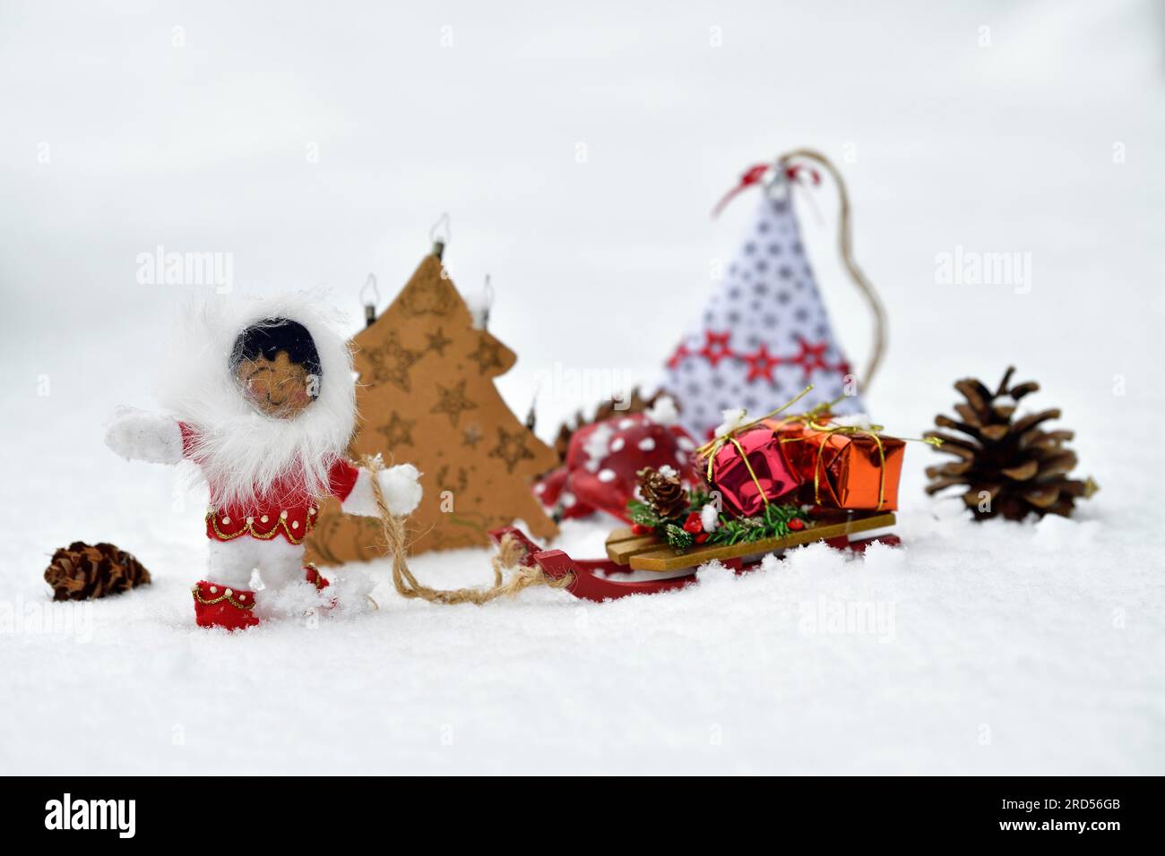 Christmas decoration, Inuit pulling sleigh with Christmas presents ...