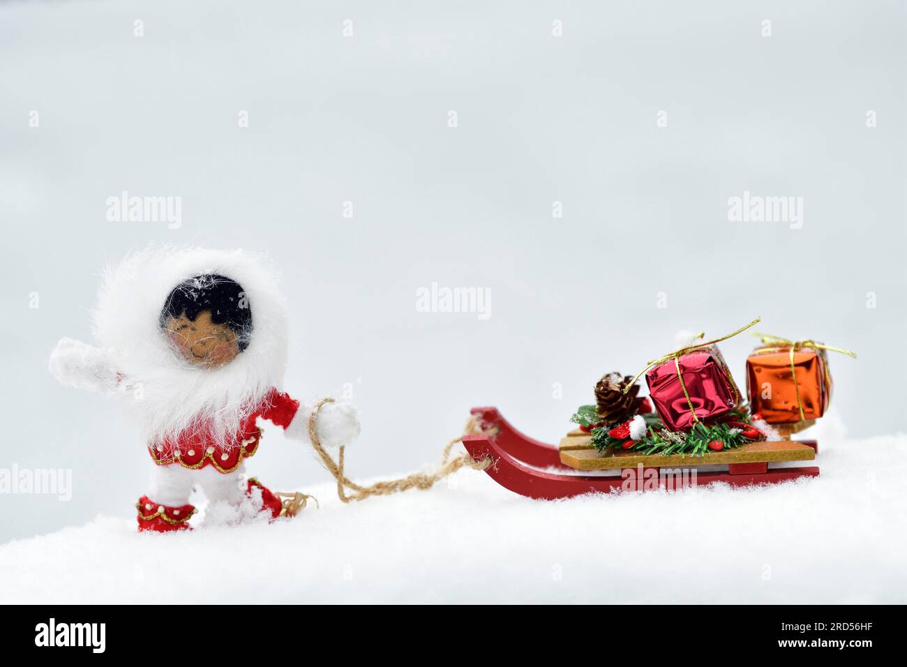 Christmas decoration, Inuit pulling sleigh with Christmas presents ...
