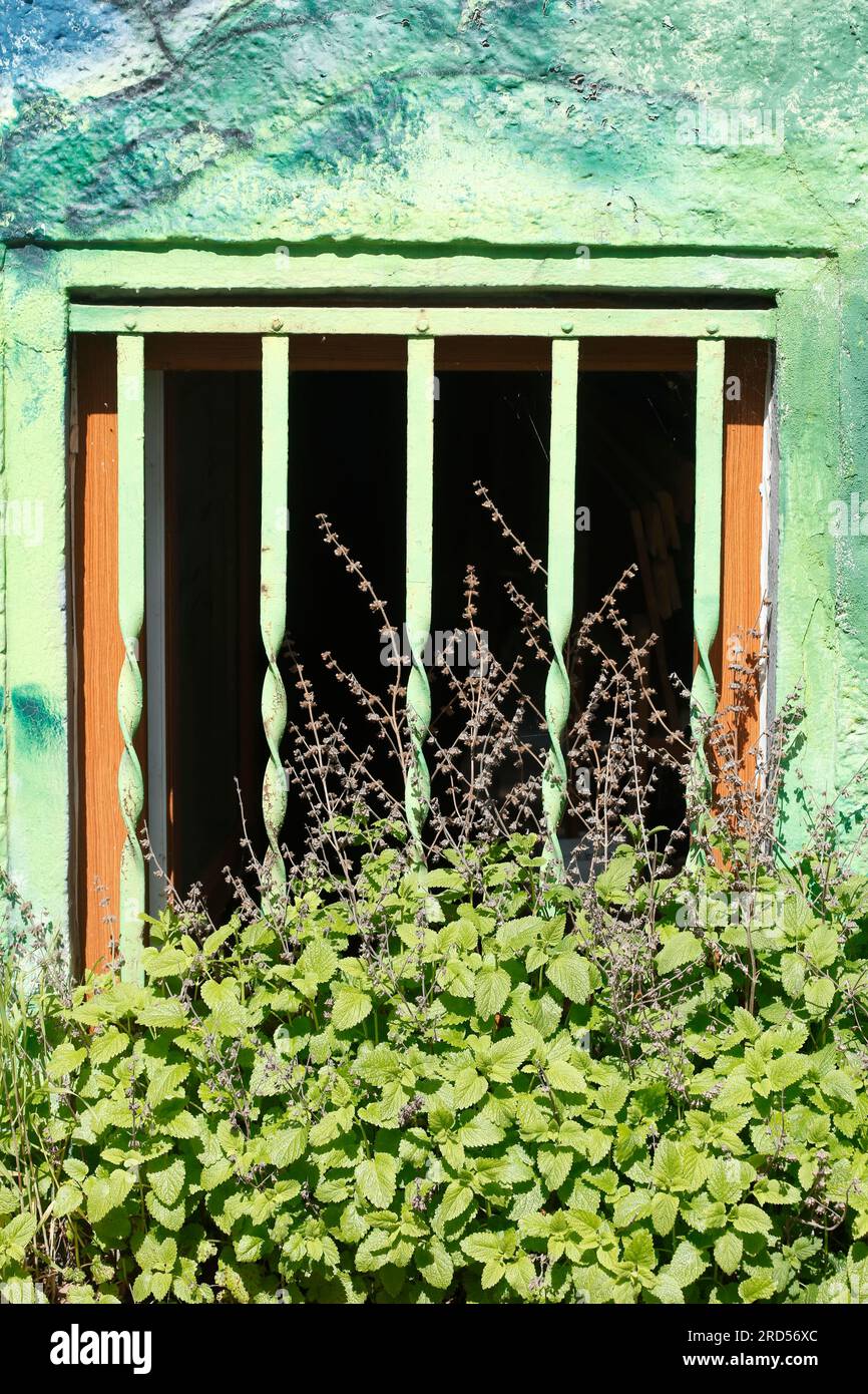 Old barred green cellar window, Germany Stock Photo - Alamy