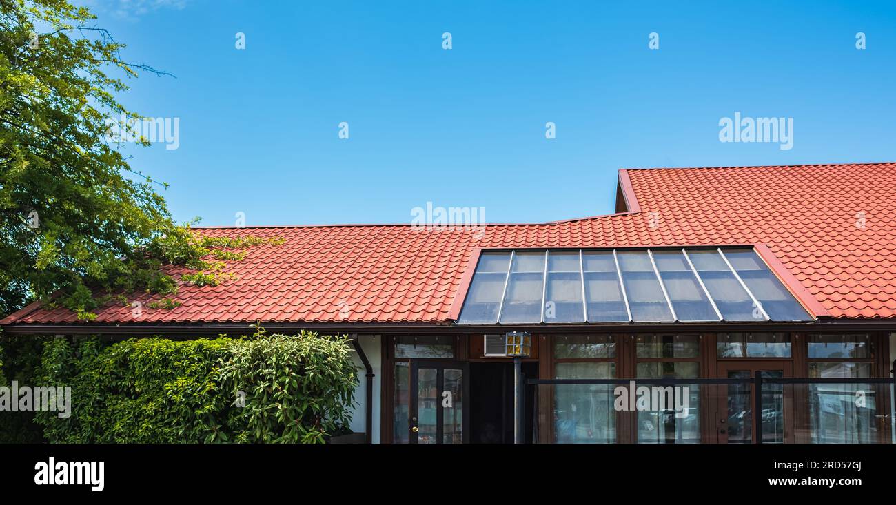 The roof of the house is made of red metal tiles. Tiled Metallic Roof ...
