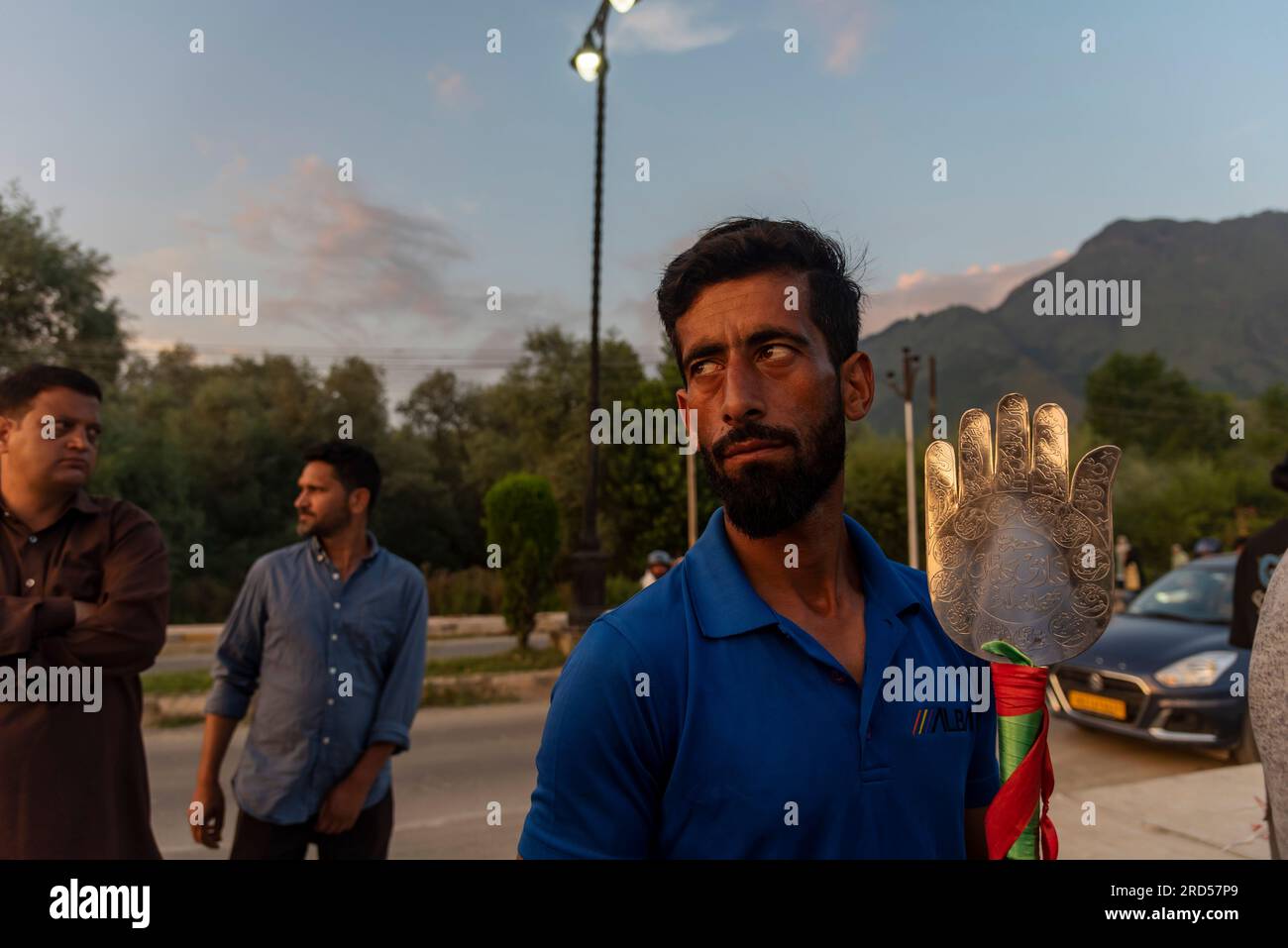 Srinagar, India. 18th July, 2023. A Shia Muslim man looks on as he ...