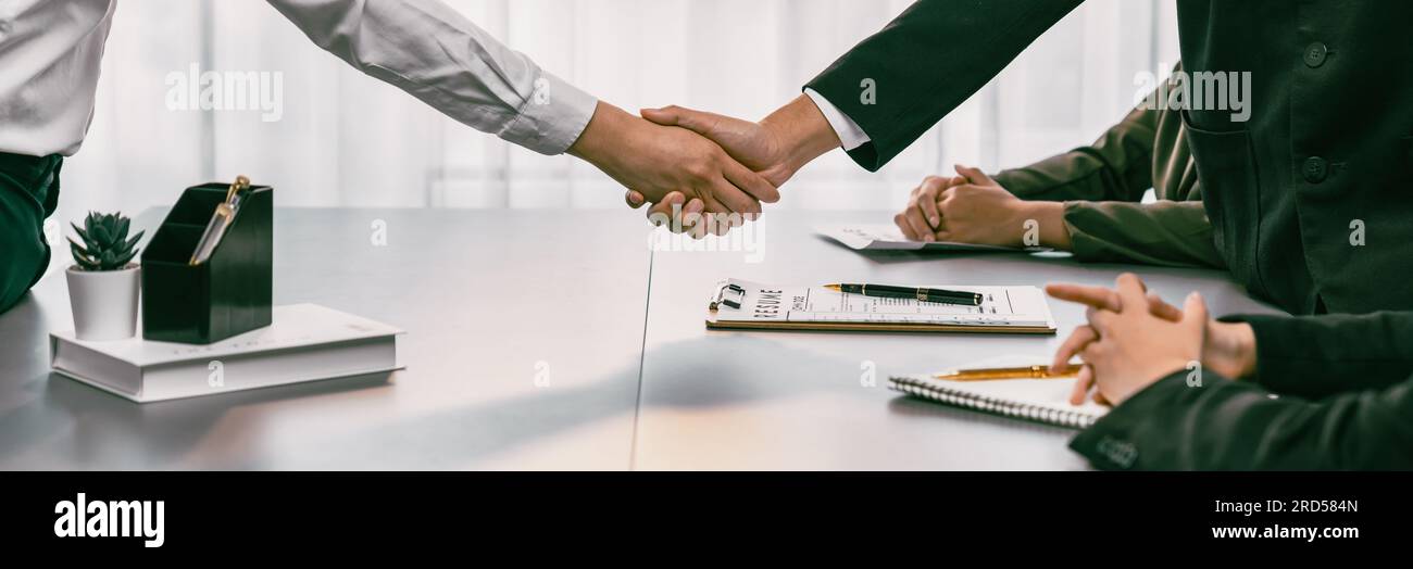 Interviewer handshaking the applicant hi-res stock photography and ...