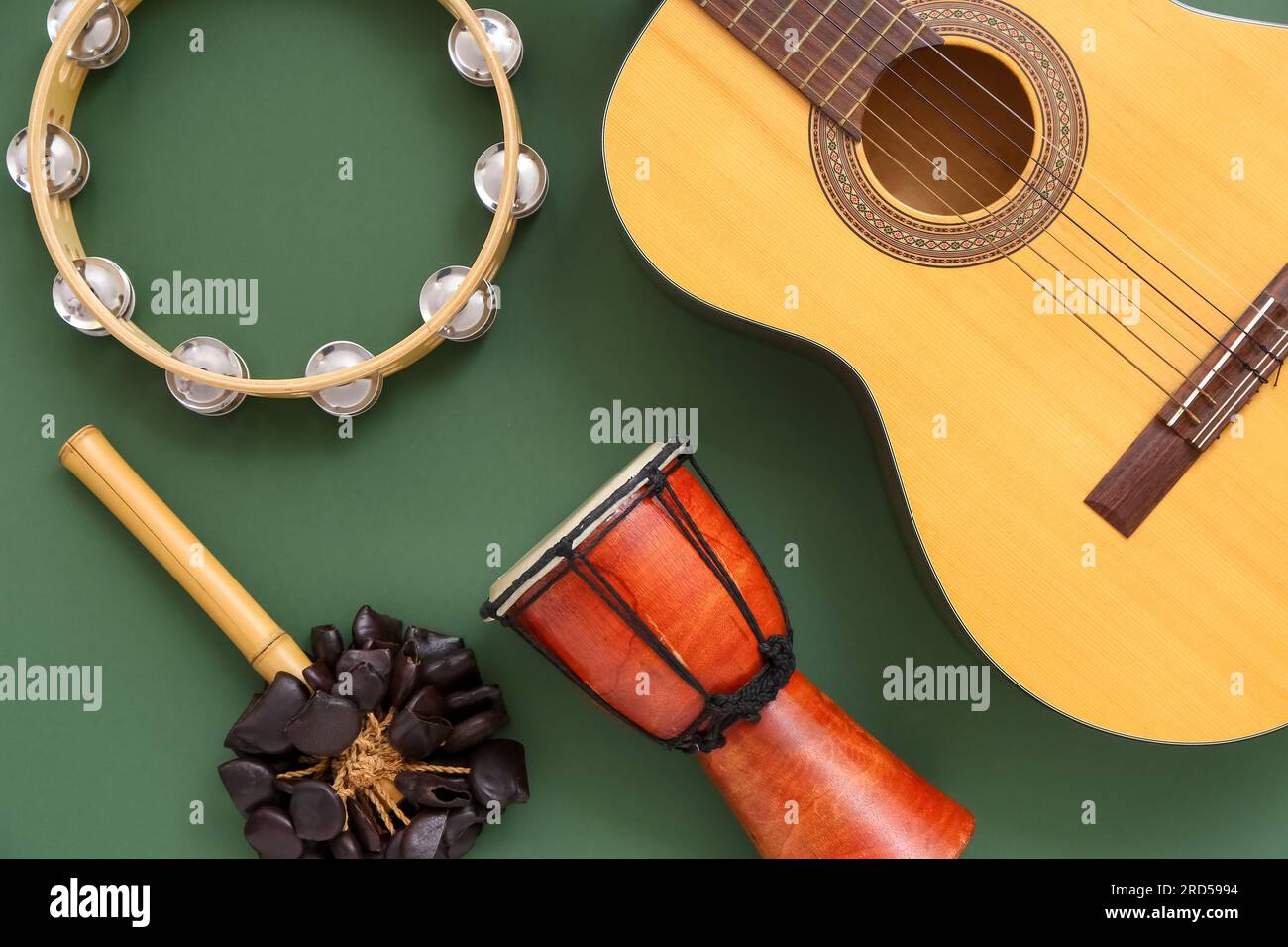 Different musical instruments on color background Stock Photo - Alamy