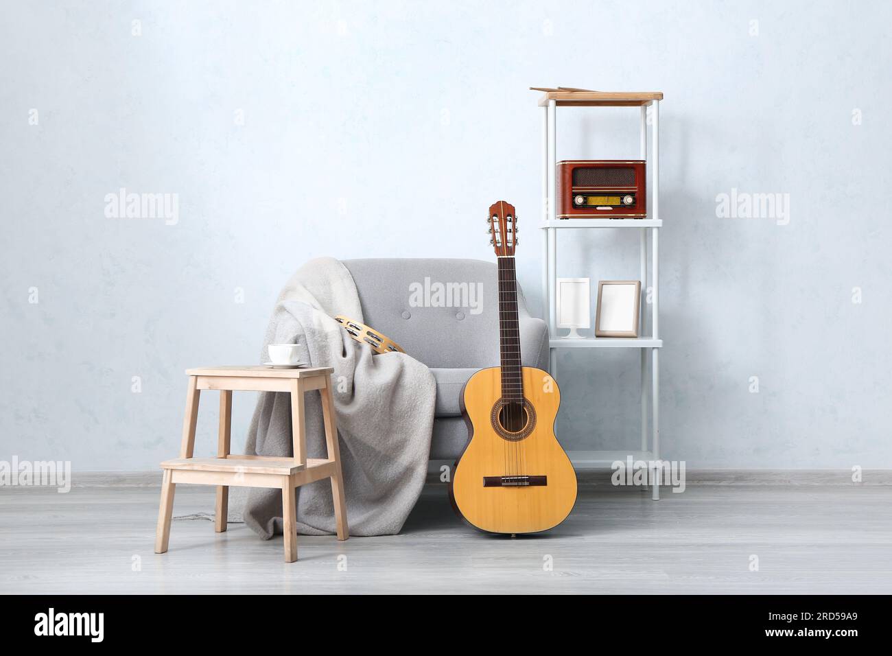 Interior of room with armchair and musical instruments Stock Photo - Alamy