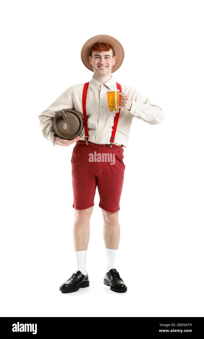 Young man in traditional German clothes with beer on white background ...