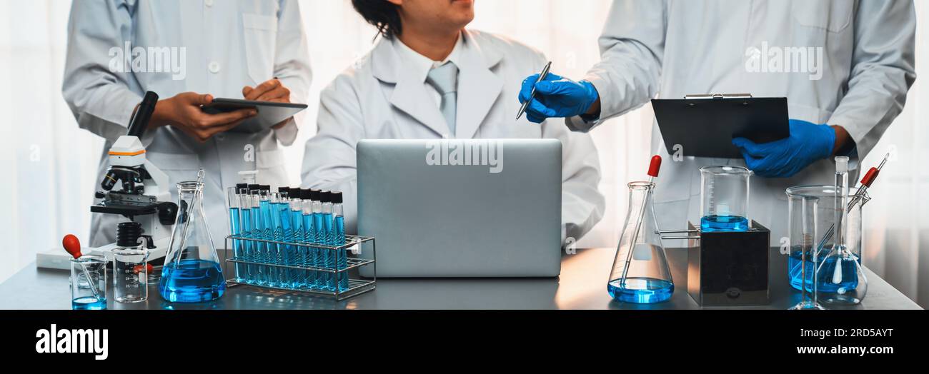 Group of dedicated scientist conduct chemical experiments and research ...