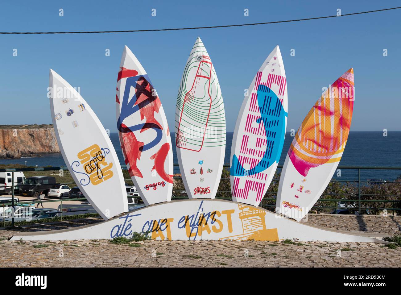Surfboards with Sagres lettering against a blue sky on the promenade at ...