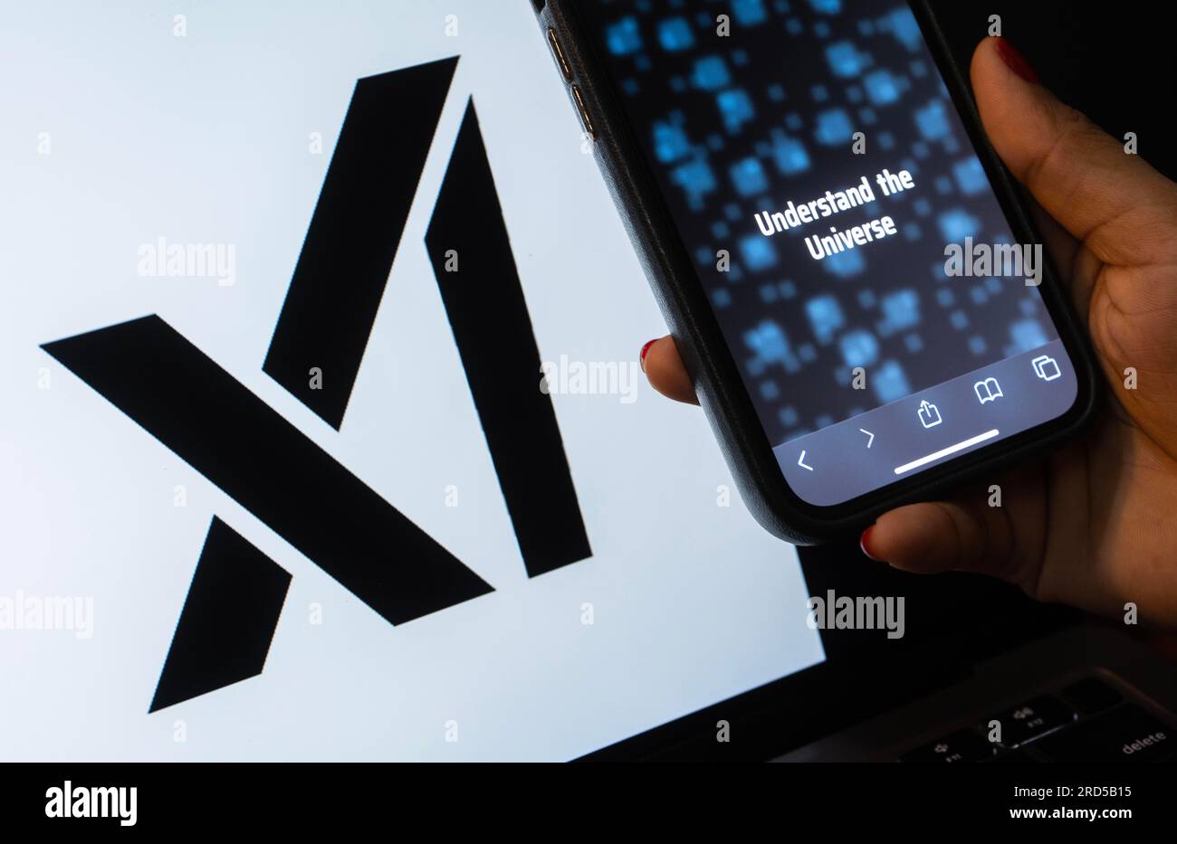 In this photo illustration, A person browses website of xAI, displayed ...