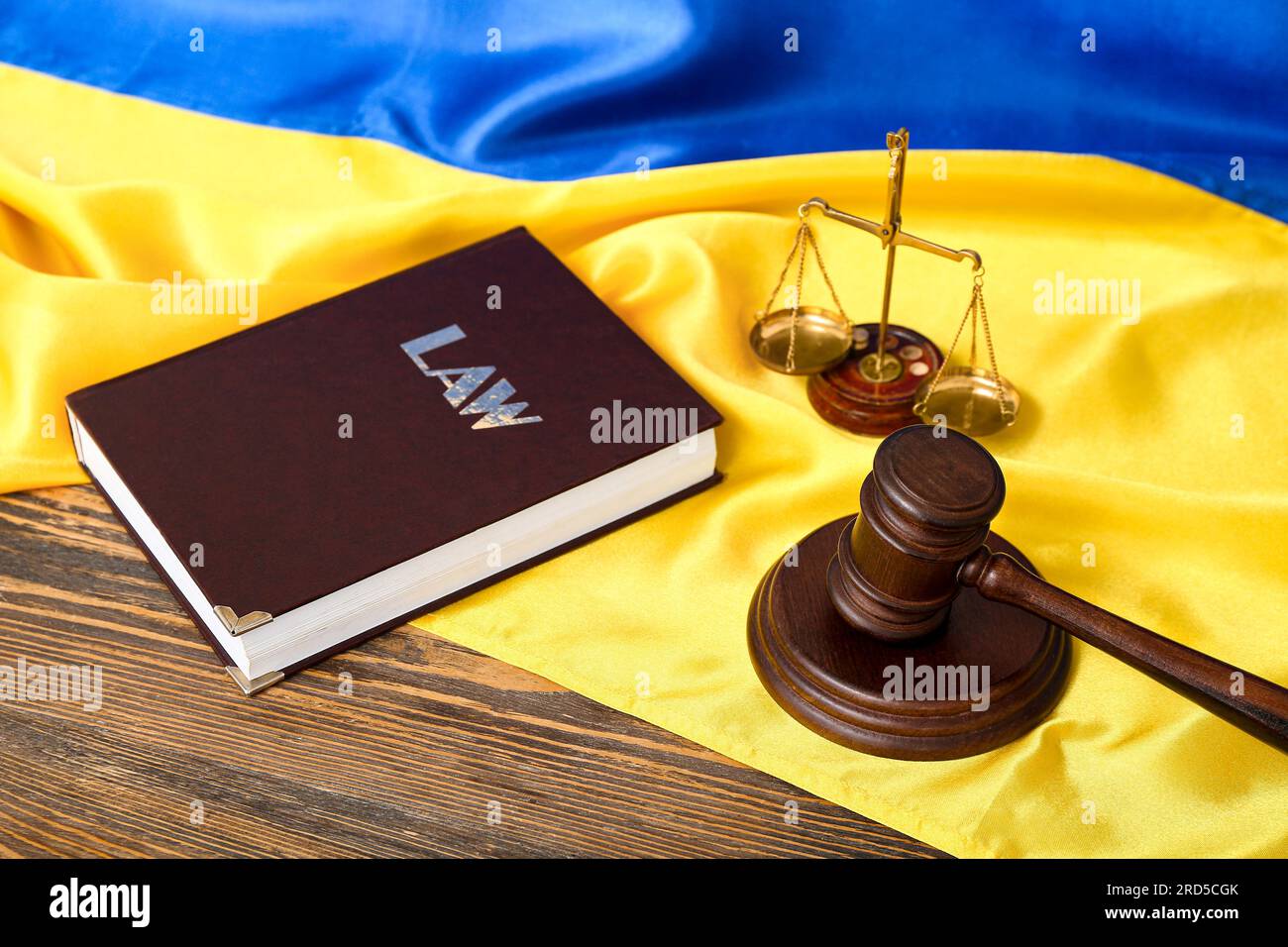 Judge's gavel, law book and scales of justice on flag of Ukraine Stock ...