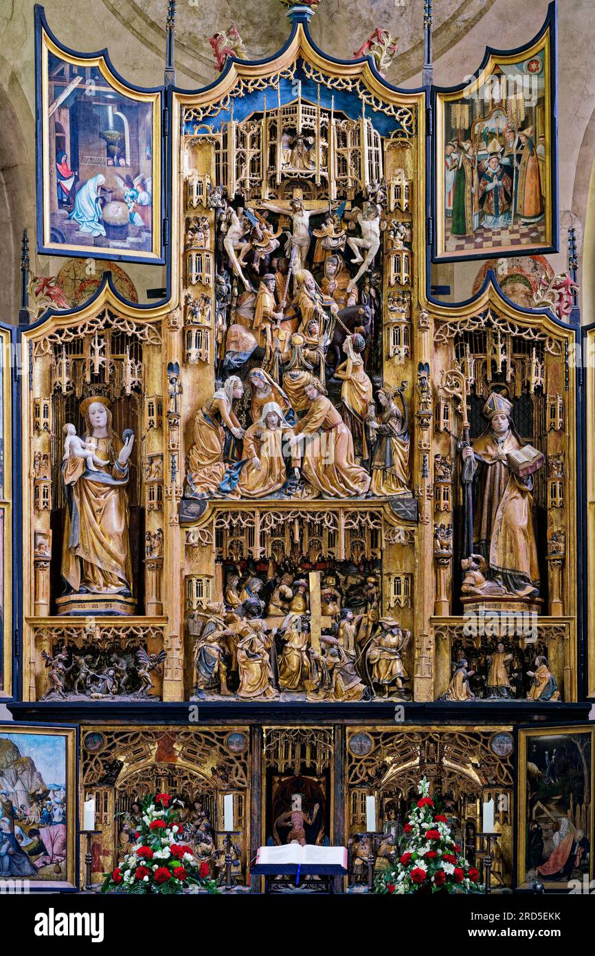 Central carved winged altar with predella, above Crucifixion of Jesus ...
