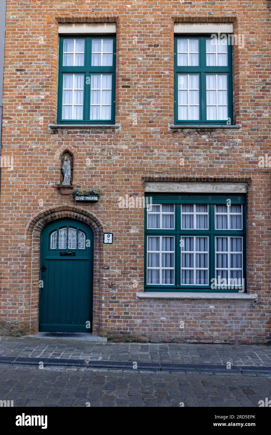 Decorative house facade with colourful door, city centre, Bruges ...