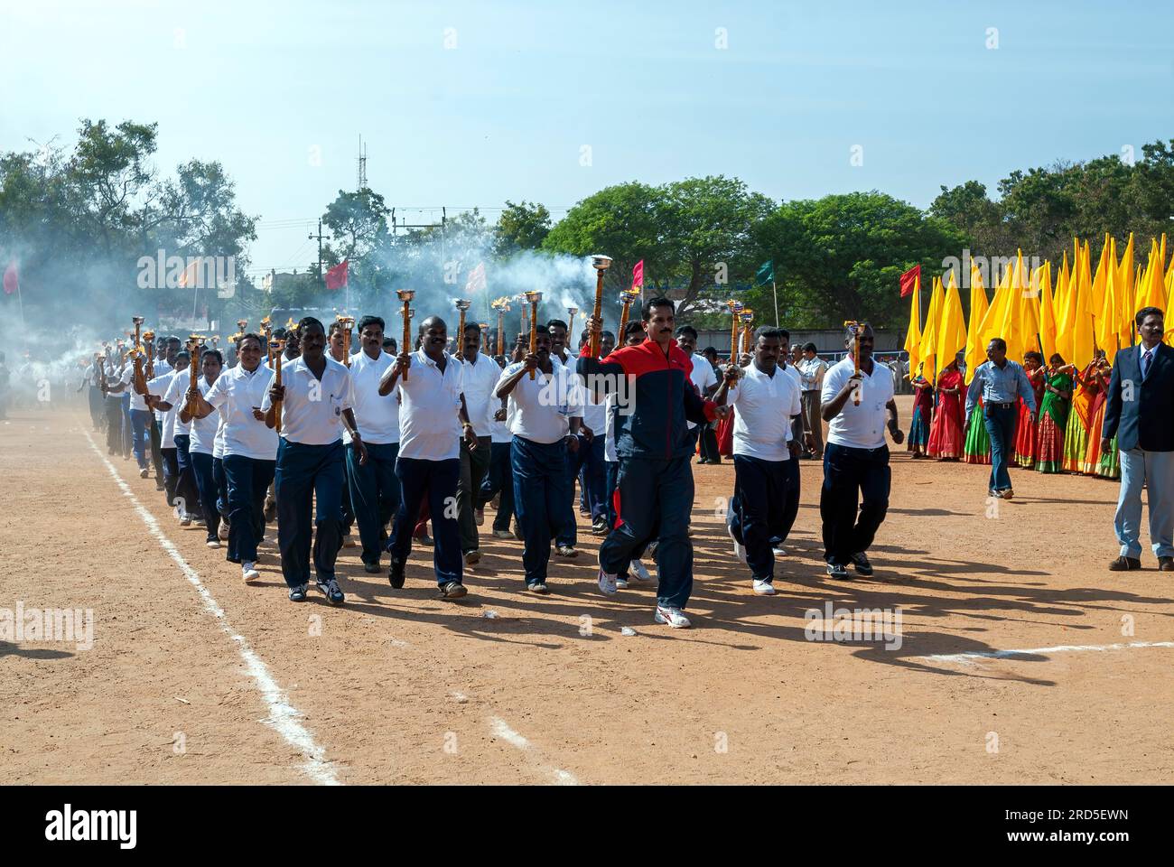 Police personnel carrying torches during Police Public sports festival ...