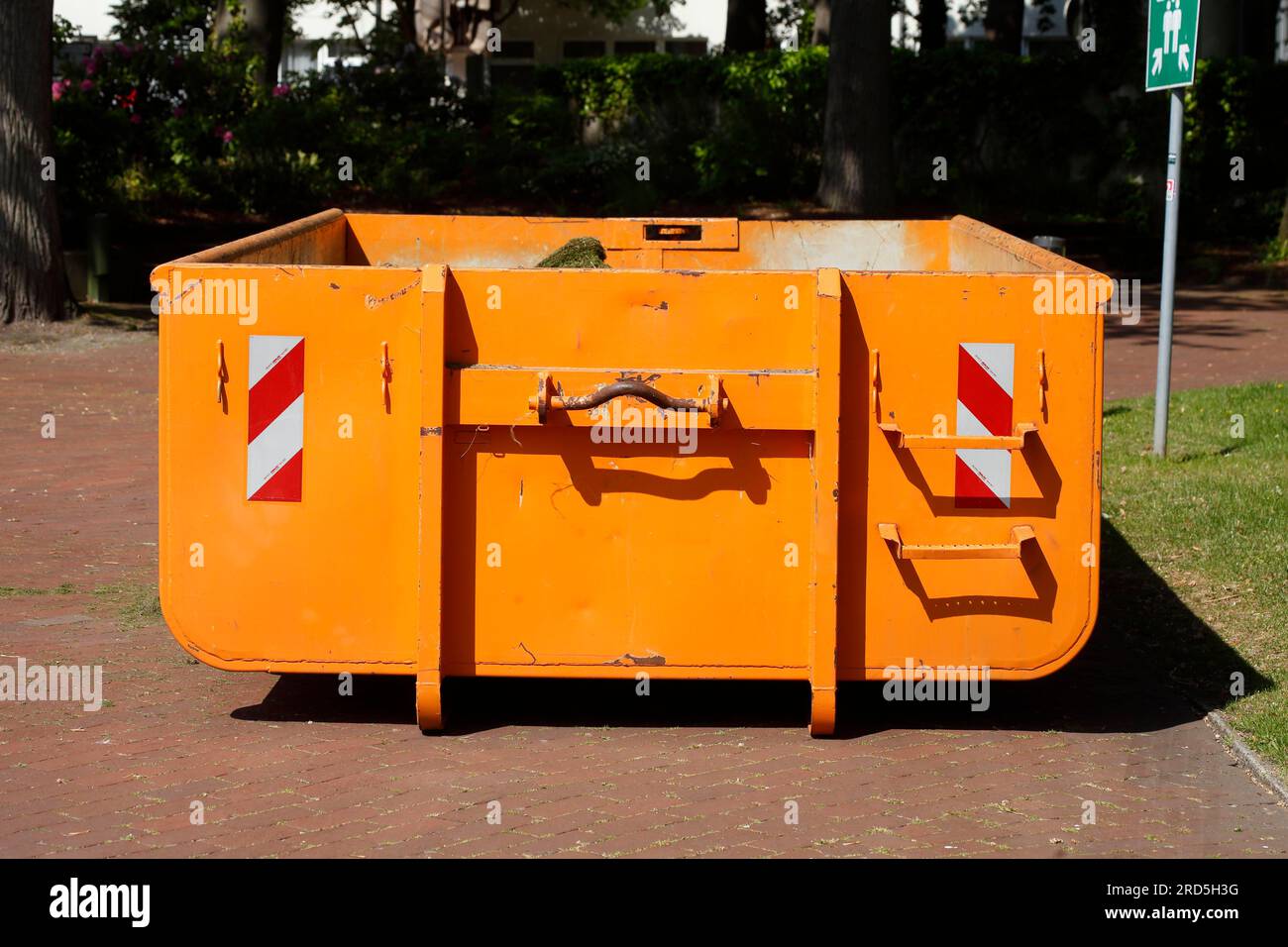 Orange skip with plant waste, waste container, Germany Stock Photo - Alamy
