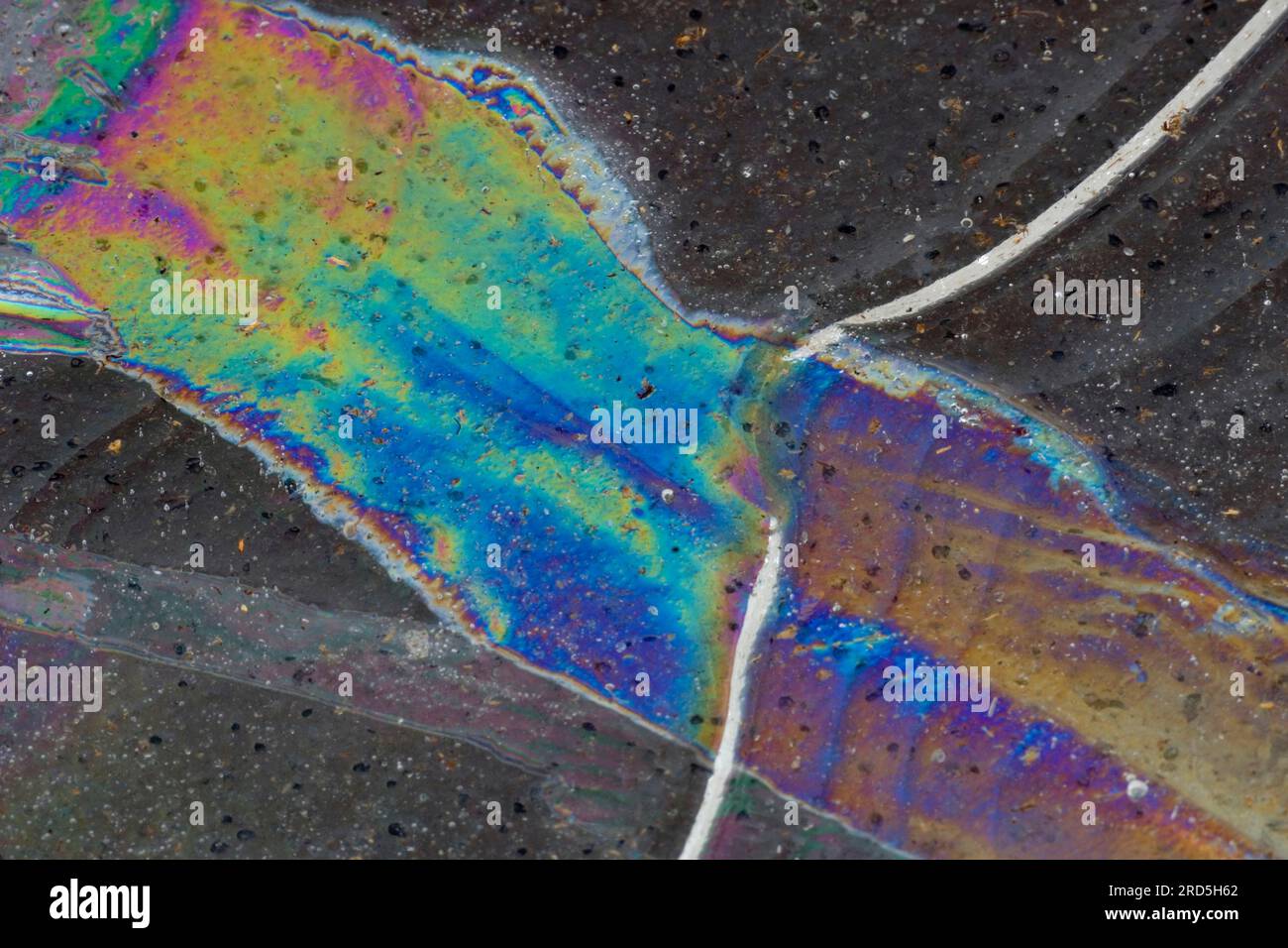 Frozen puddle, spectral color, puddle Stock Photo - Alamy