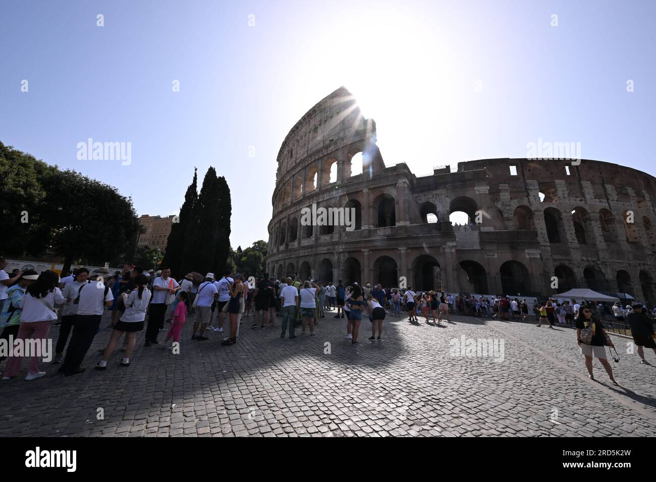 Rome, Italy. 18th July, 2023. Tourists wait in the shade outside the ...