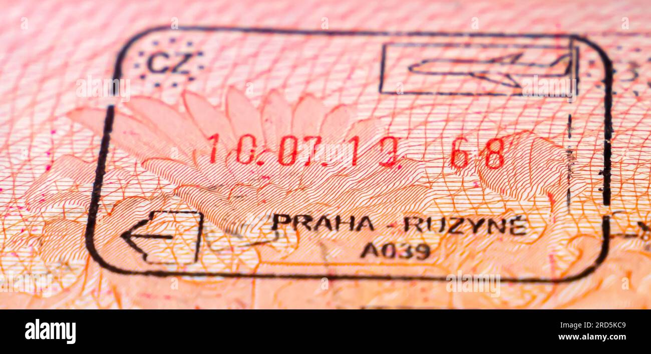 Czech Republic border crossing stamp in an open passport. Praha Ruzyne ...