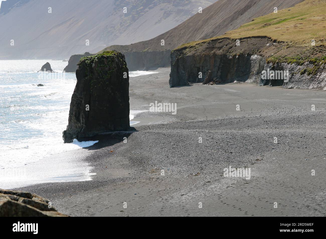 Panorama of Laekjavik beach rock formation sea stack black sand ...