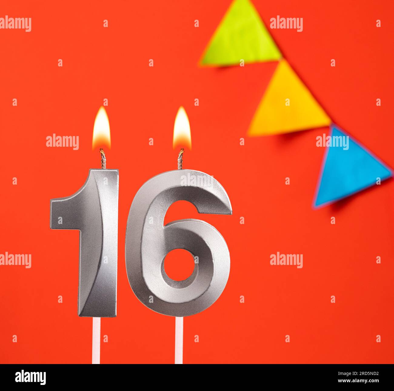 Birthday card - Number 16 candle in orange background Stock Photo - Alamy