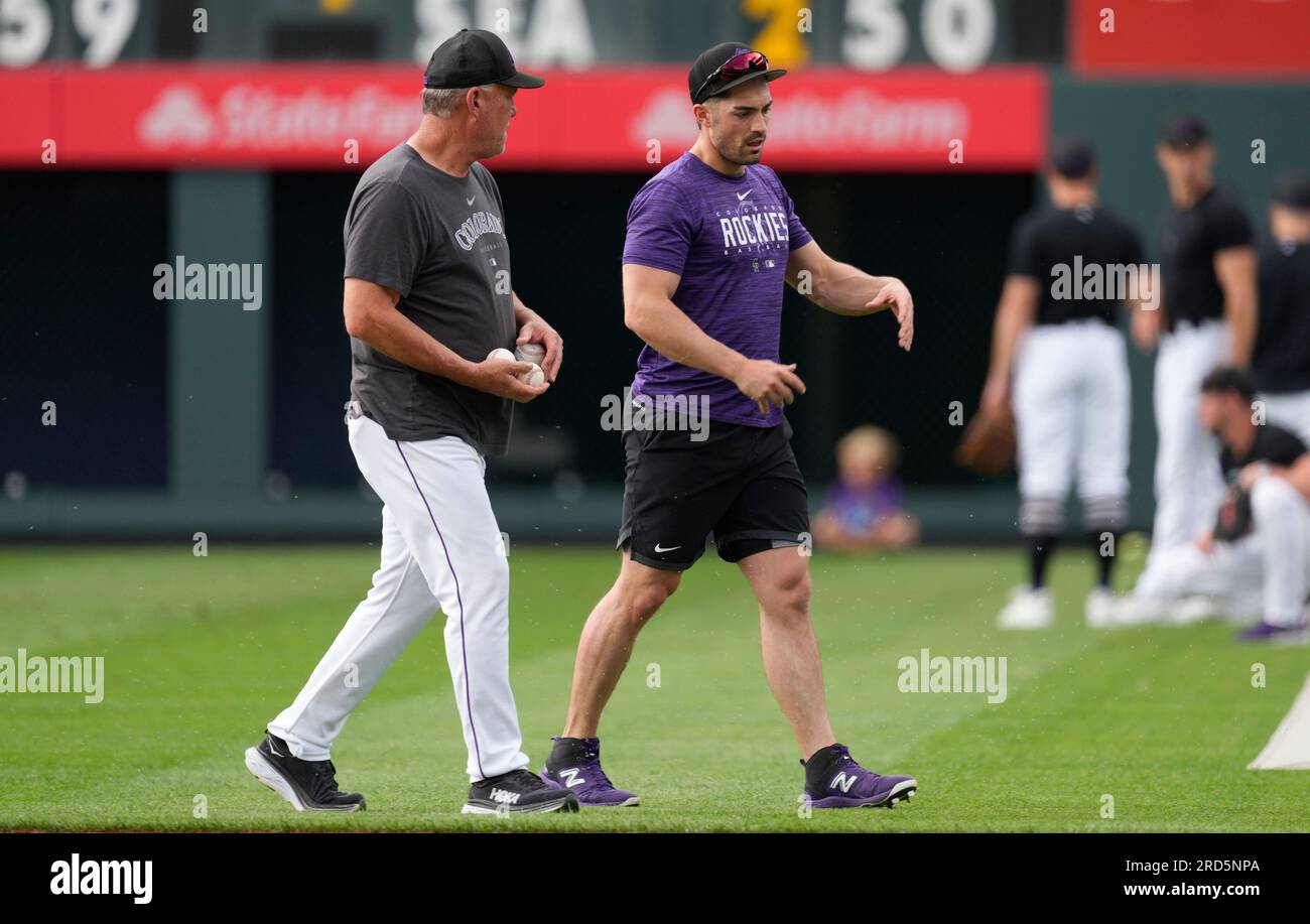 Colorado Rockies first base coach Ron Gideon, left, chats with injured ...