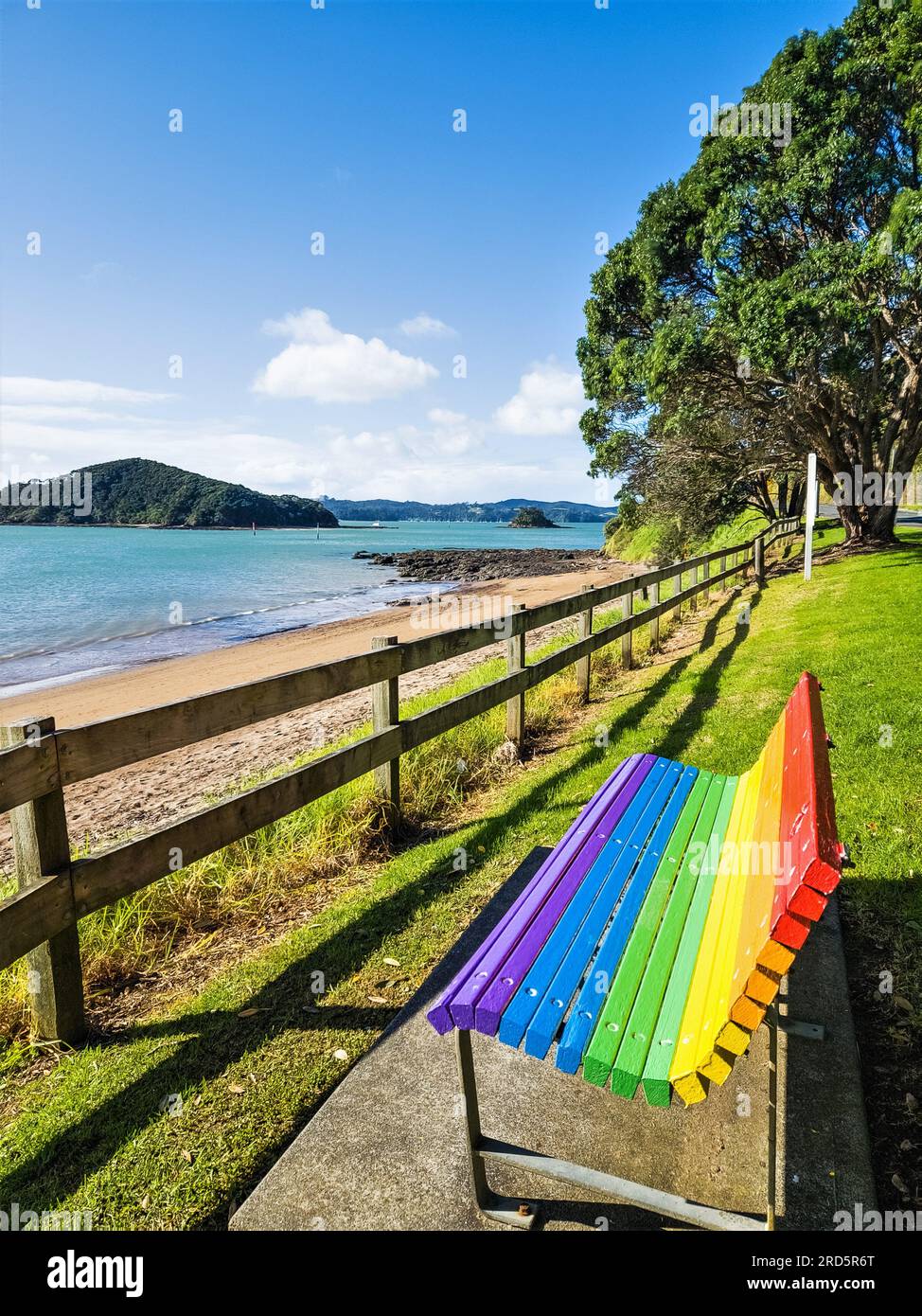 Paihia, New Zealand - July 1, 2023: A rainbow painted bench seat on the ...