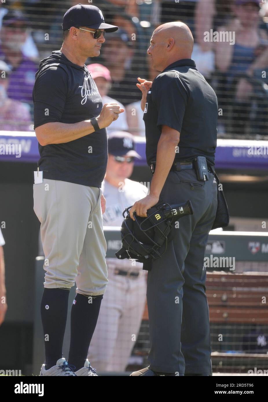 New York Yankees manager Aaron Boone (17) confers with home plate ...
