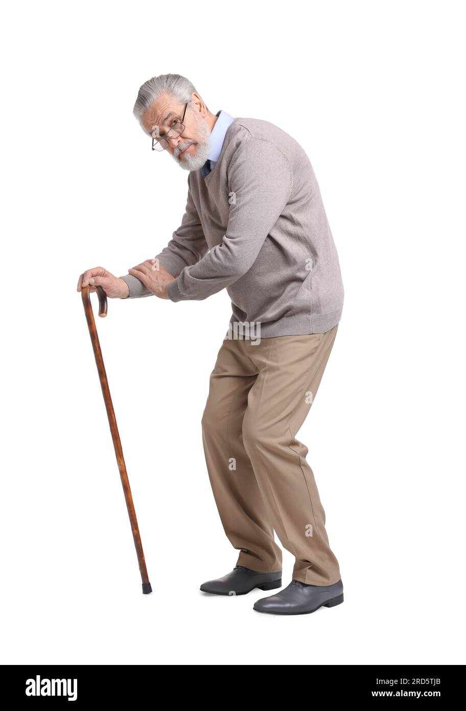 Stooped senior man with walking cane on white background Stock Photo ...