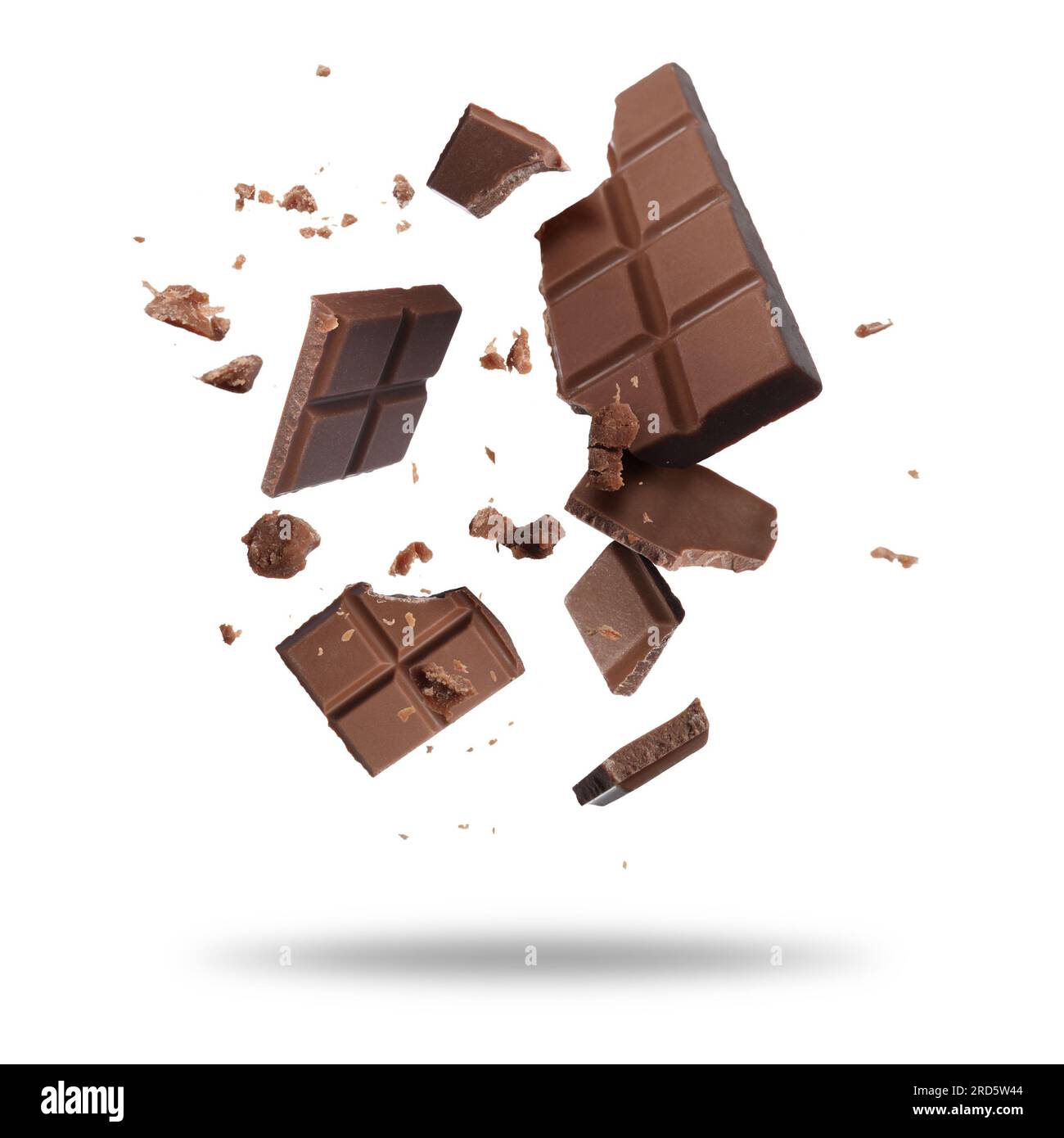 Broken chocolate bar pieces falling on white background Stock Photo - Alamy