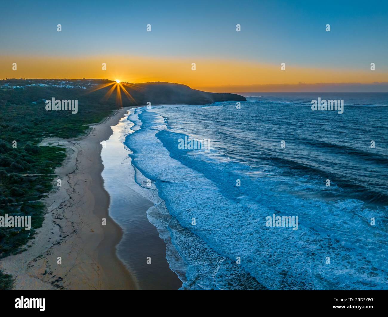 Aerial sunrise seascape with good size waves at Killcare Beach on the ...