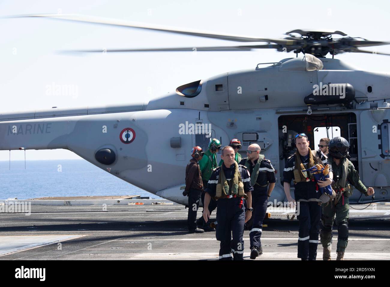 Capt. Laurent Saunois, center, commanding officer, French Navy frigate ...