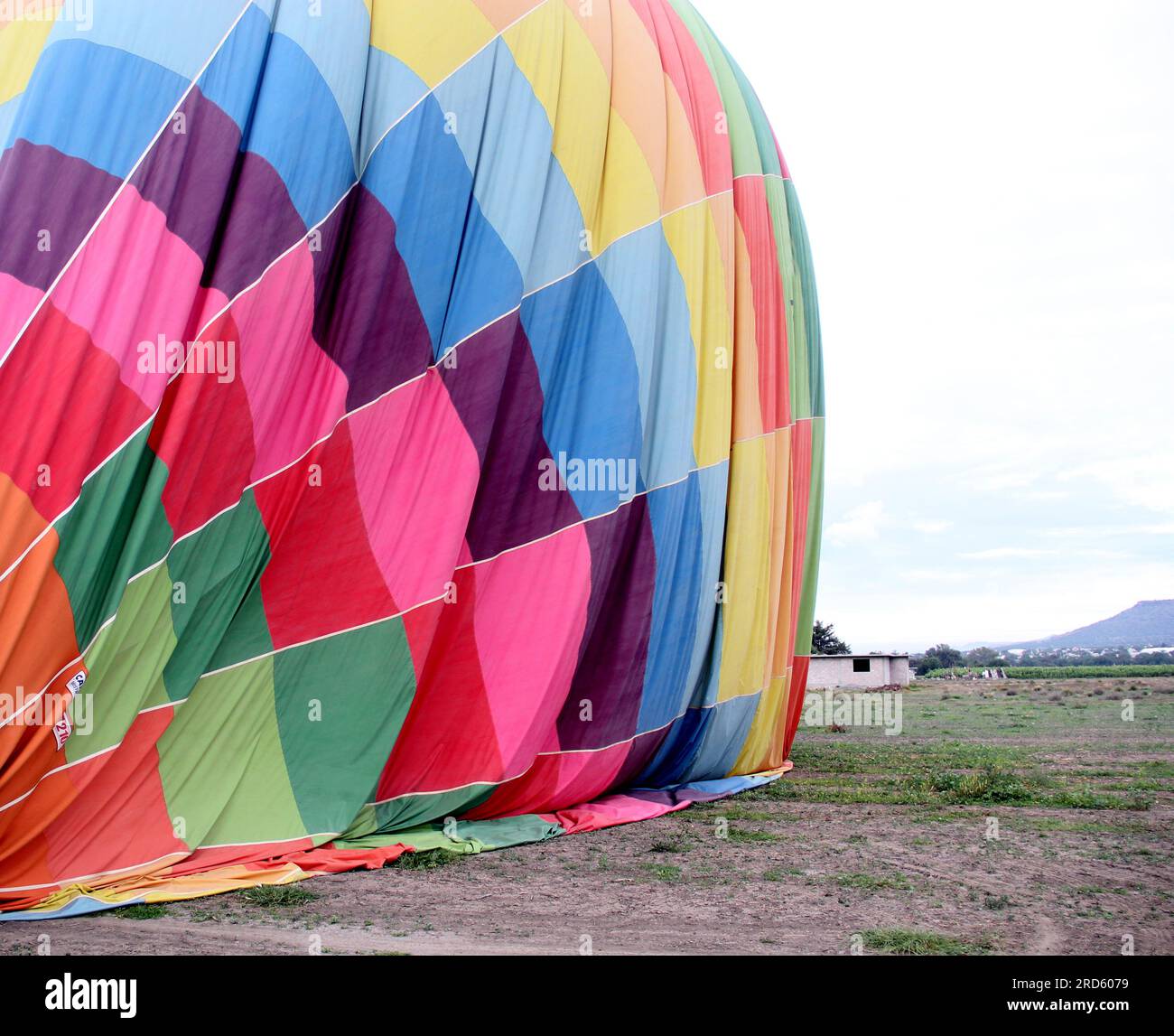 Process of inflation and preparation of hot air balloon at sunrise for ...
