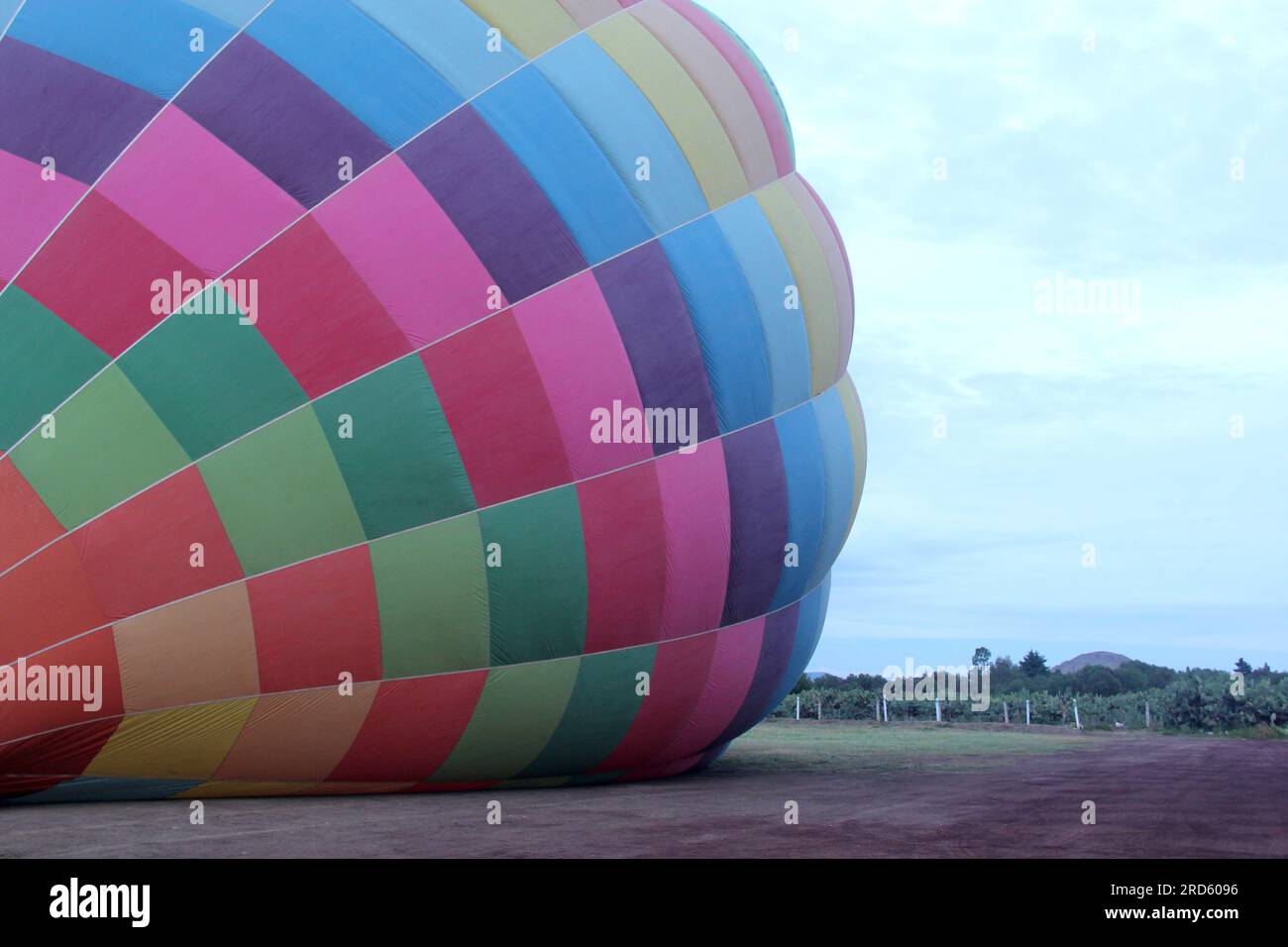 Process of inflation and preparation of hot air balloon at sunrise for ...