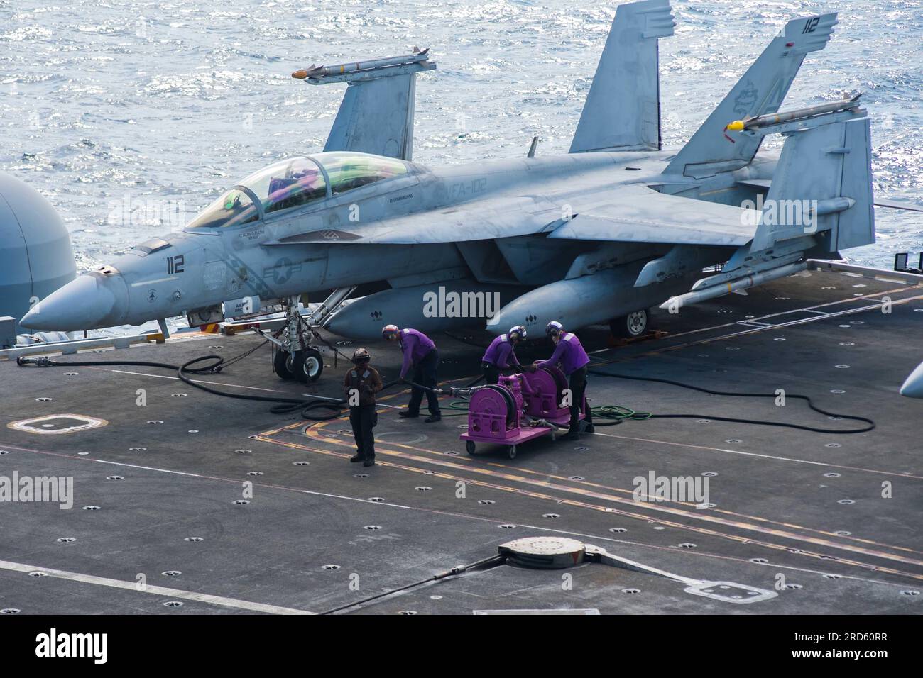230714-N-BE723-1007 INDIAN OCEAN (July 14, 2023) Sailors refuel an F/A ...