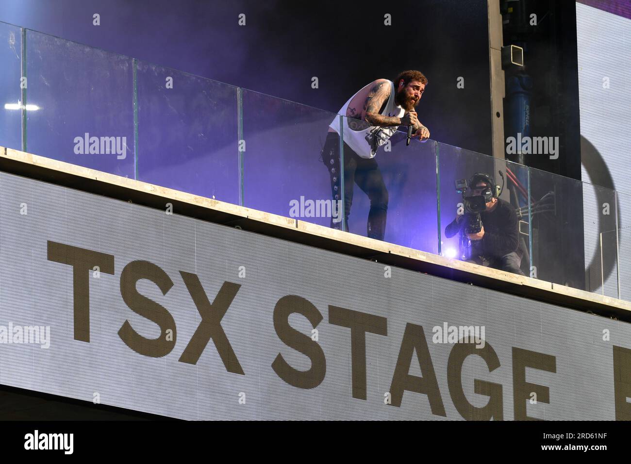 Post Malone performs a free concert on an outdoor stage at TSX Broadway ...