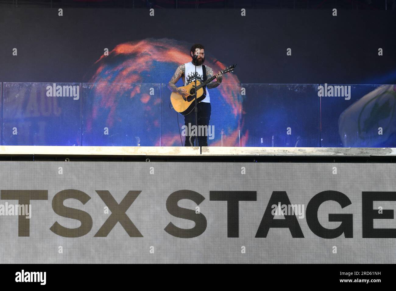 Post Malone performs a free concert on an outdoor stage at TSX Broadway ...