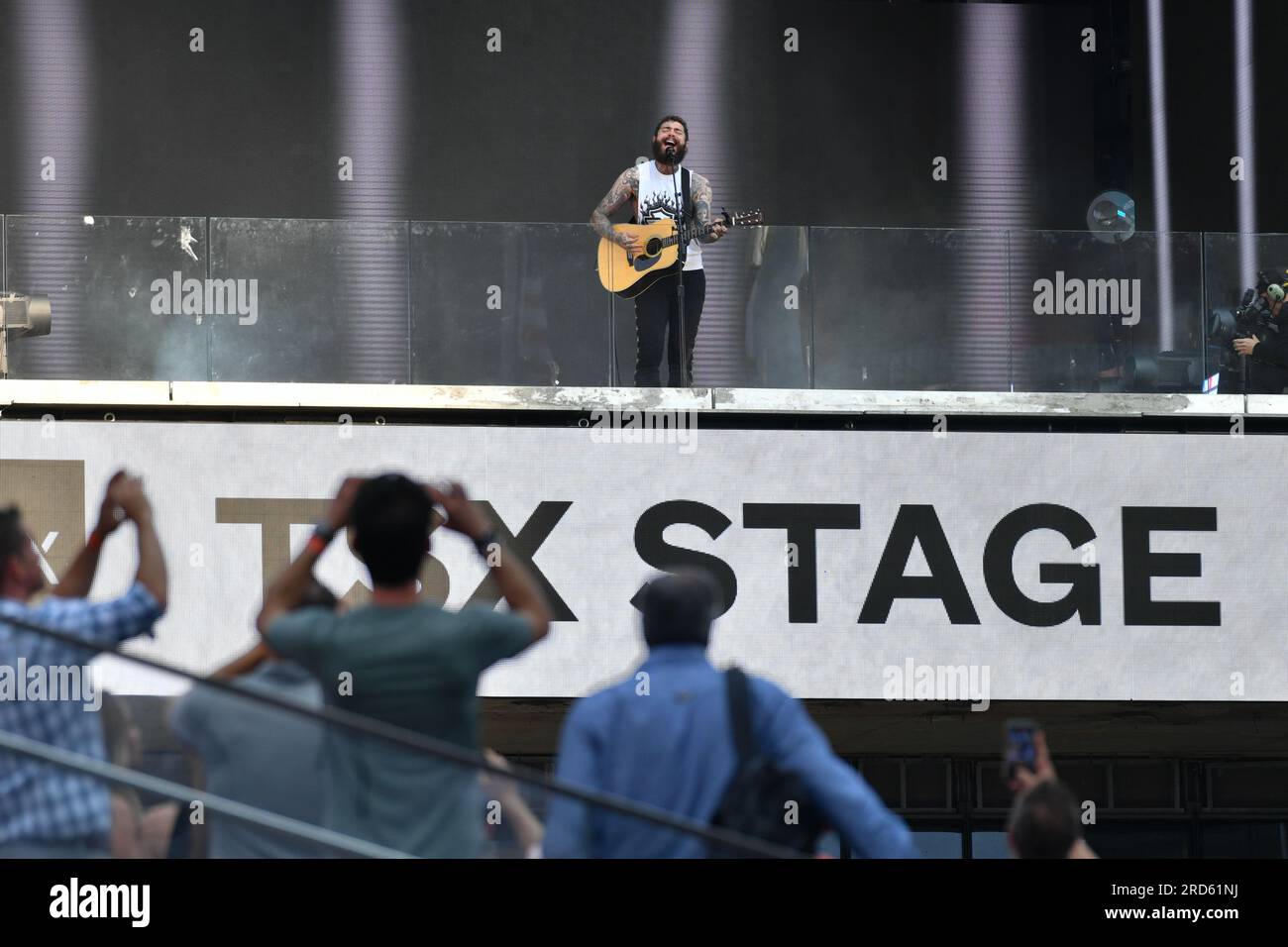 Post Malone performs a free concert on an outdoor stage at TSX Broadway ...