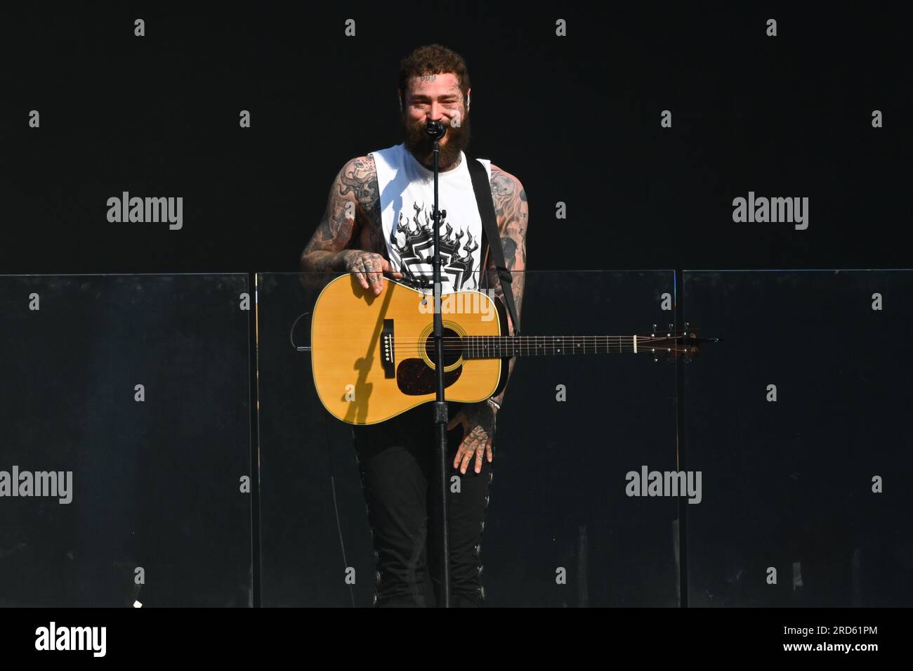 Post Malone performs a free concert on an outdoor stage at TSX Broadway ...