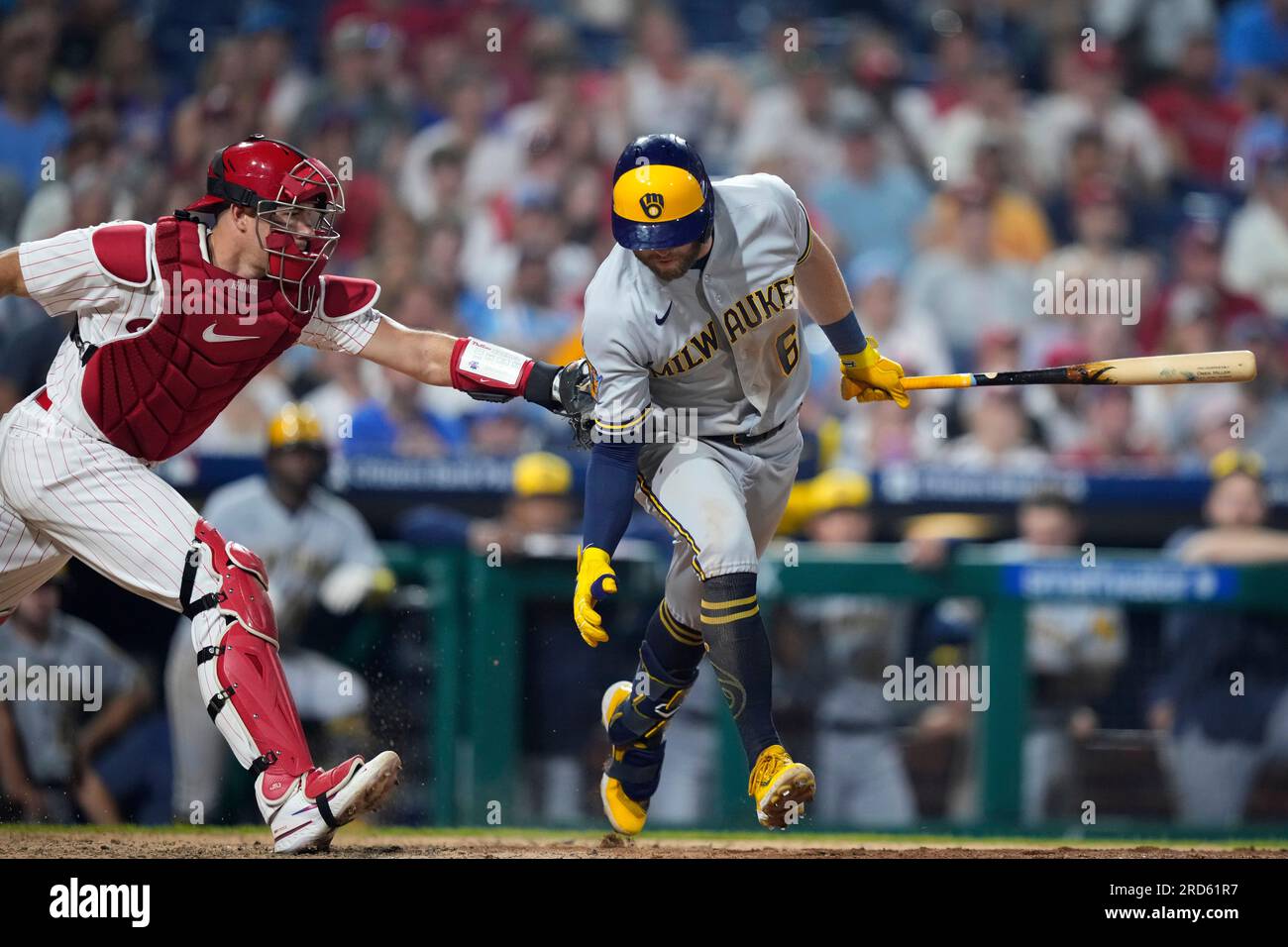 Philadelphia Phillies catcher J.T. Realmuto, left, tags out Milwaukee ...