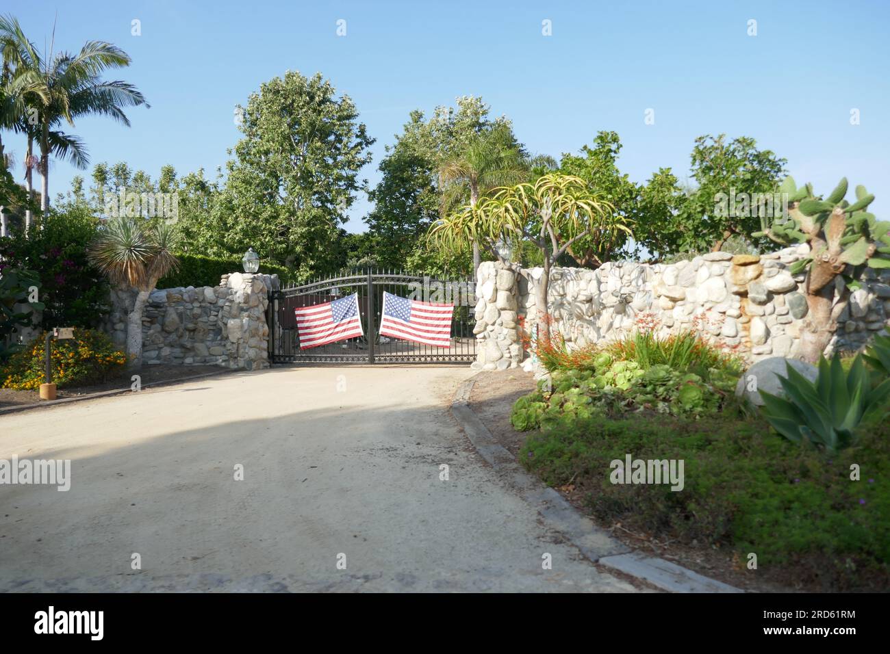 Malibu, California, USA 16th July 2023 American Flags on Gate at Home ...