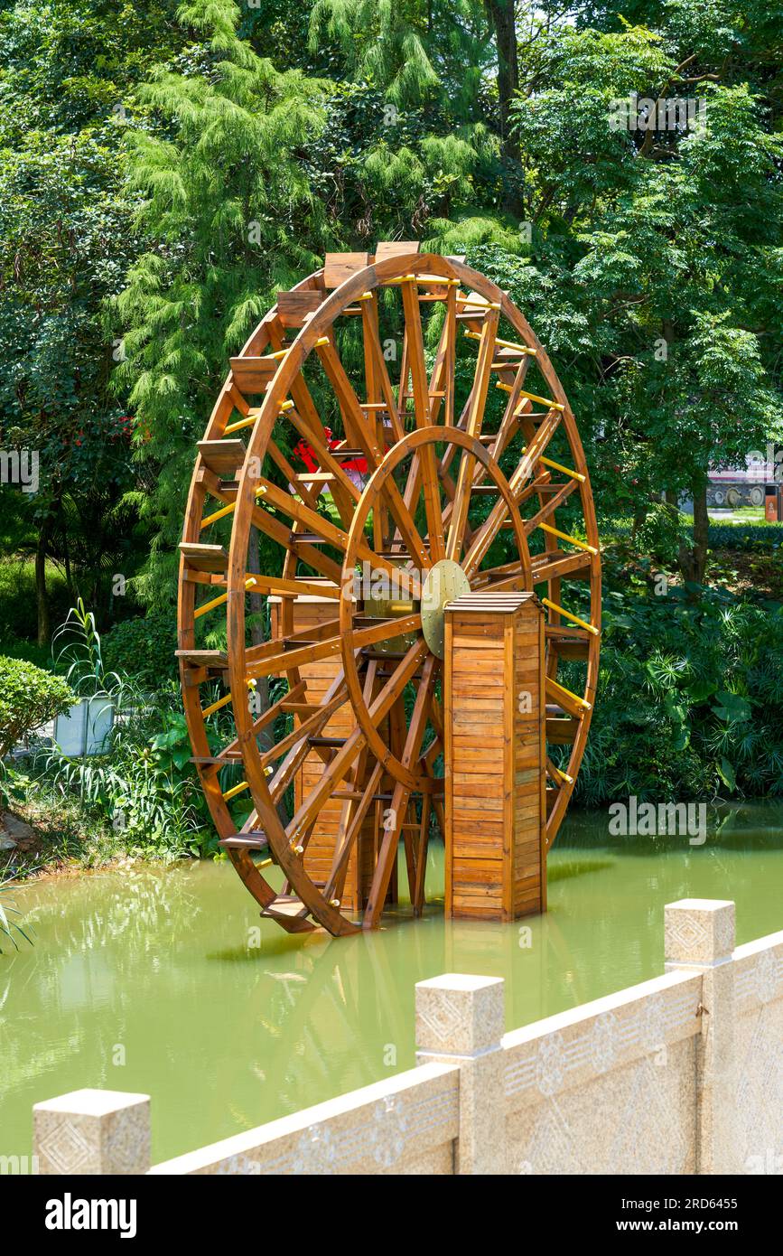 Wooden waterwheel in a pond in rural China Stock Photo - Alamy