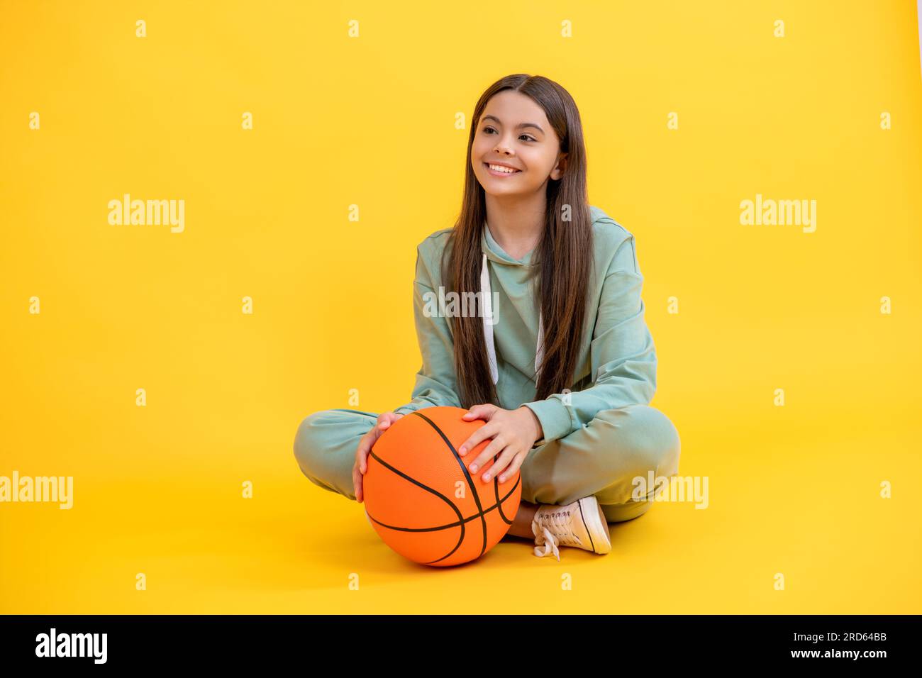 Competitive teen girl playing basketball. teen girl practicing ...