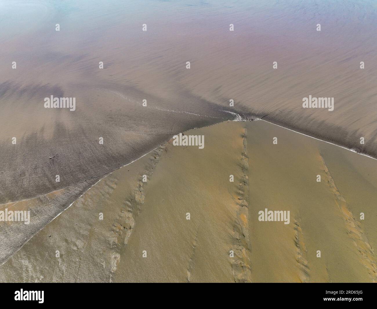 Aerial photo shows rare three-stream tidal bores converging along ...