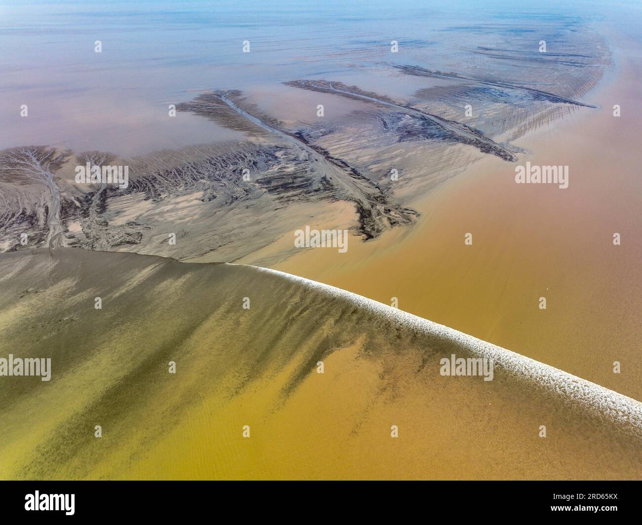 Aerial photo shows rare three-stream tidal bores converging along ...