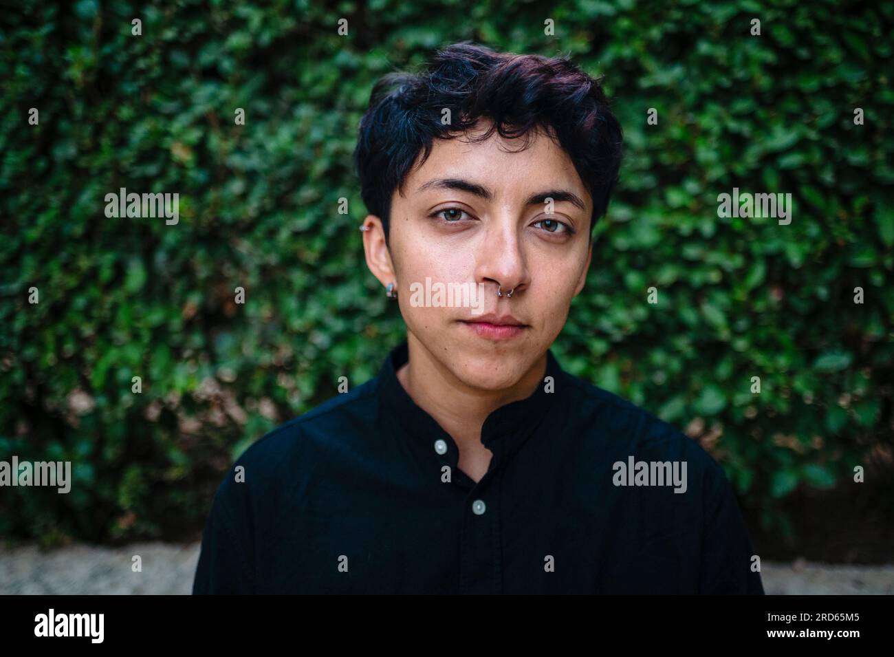 Close-up view of a transgender person posing on natural background ...