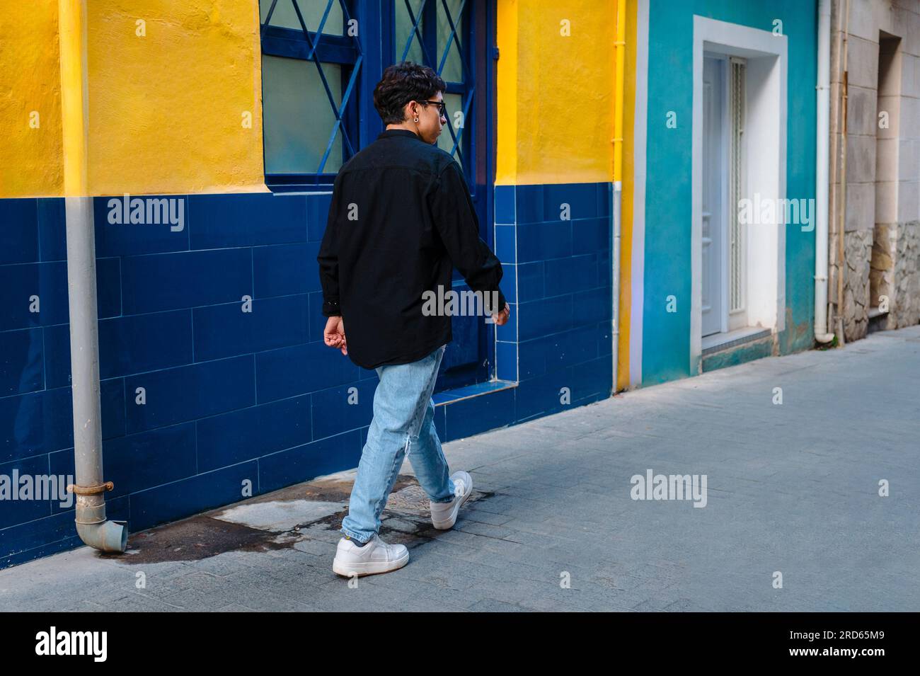 Young transgender walking outdoors on the street Stock Photo - Alamy