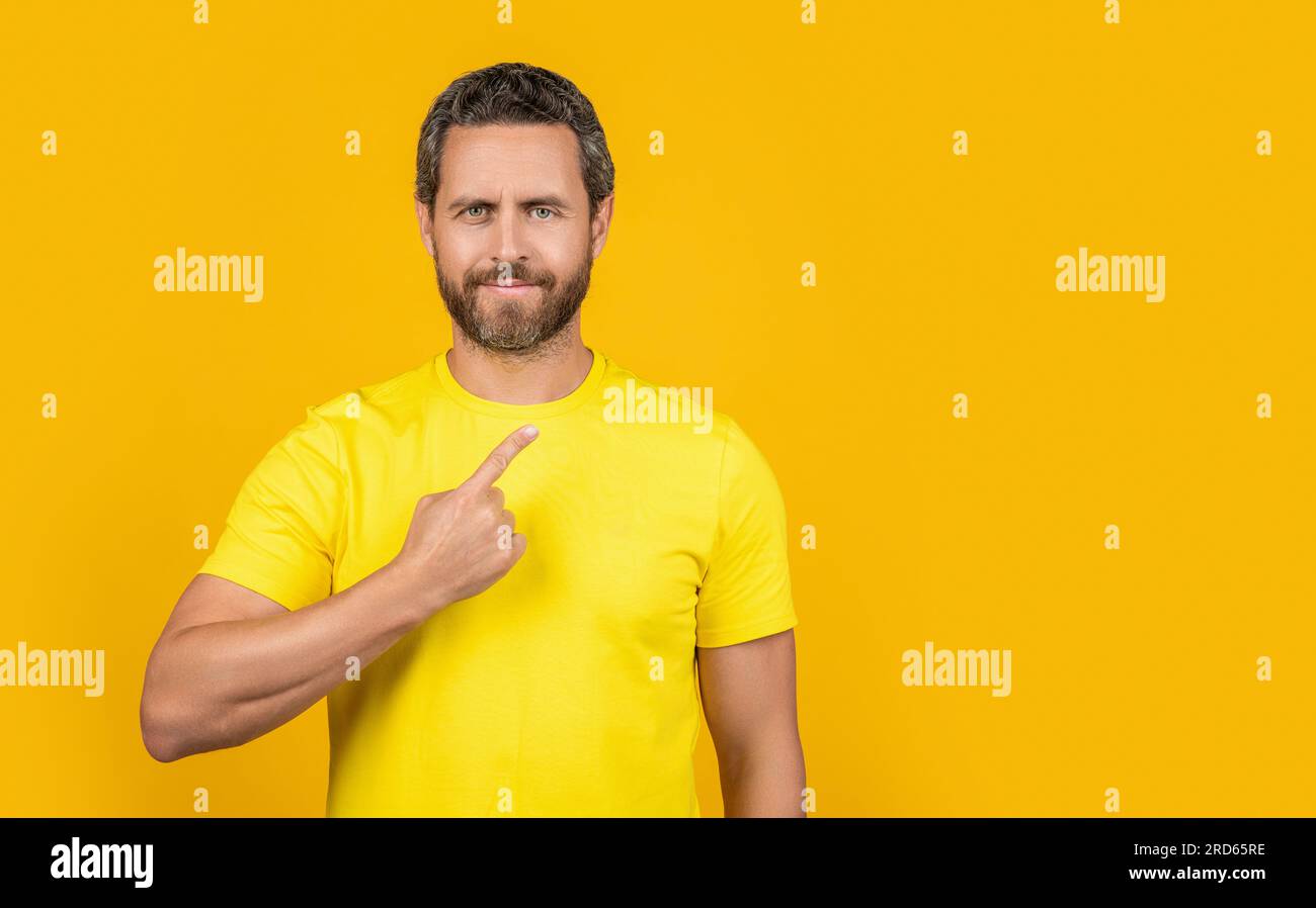 man pointing at advertisement offer in studio. image of man pointing at ...