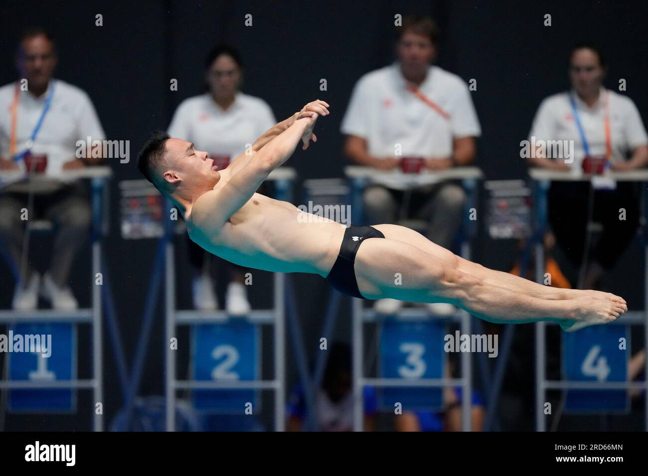 Shixin Li of Australia competes in the Men's diving 3m Springboard at ...