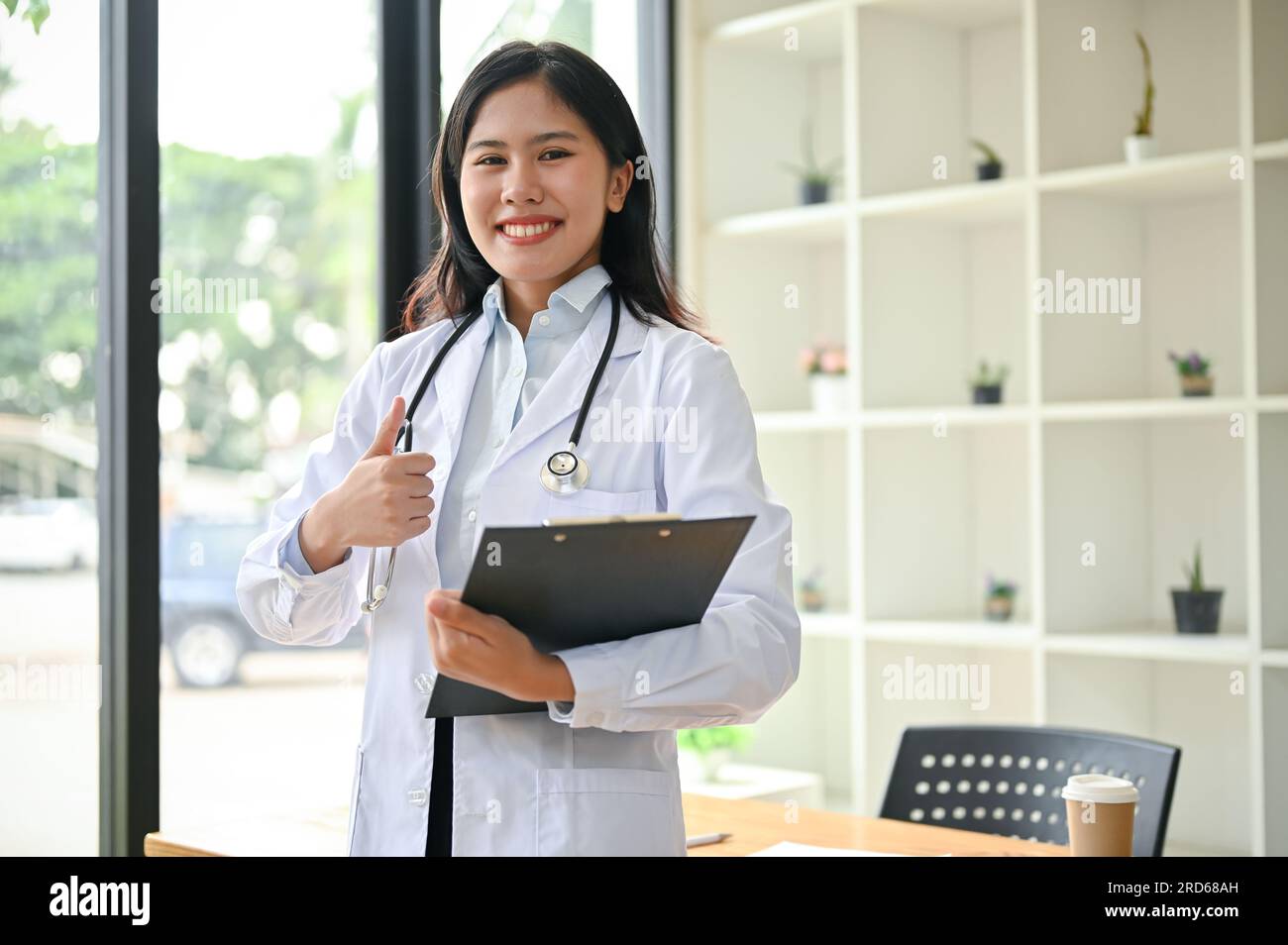 A portrait of a beautiful and successful young Asian female doctor in a ...
